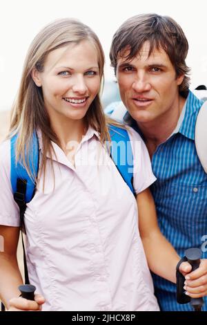 Couple ready to hike. Portrait of happy couple enjoying their vacation ...