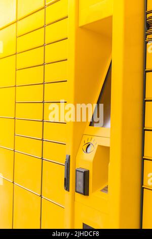 Modern yellow shopping locker. Bar code reader for Skans QR Code on ...