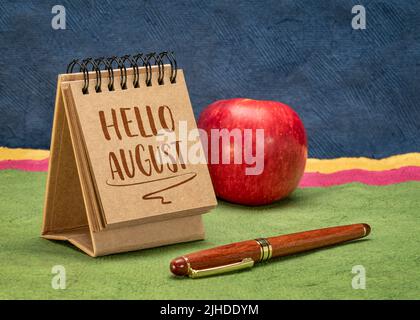 Hello August greeting note - handwriting on a white handmade paper ...