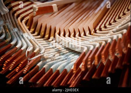 Electric motor stator under assembly. Thick copper busbars are wrapped ...