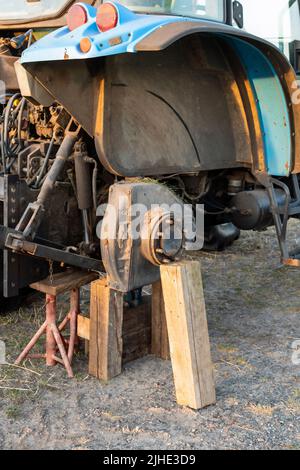 Wheel axle of the tractor Stock Photo - Alamy