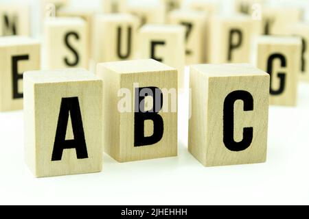 A B C letters on wooden cubes against white background Stock Photo - Alamy