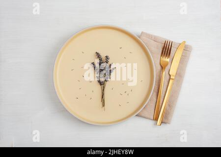 Beautiful table setting and lavender flowers in light room Stock Photo ...