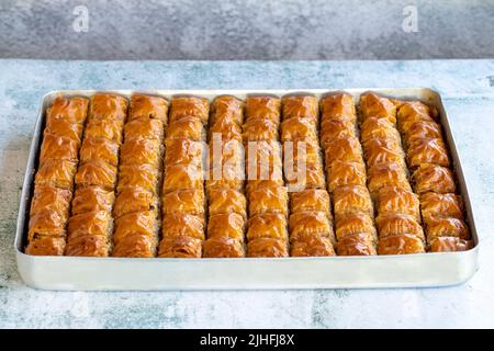 Walnut baklava. Tray baklava on stone background. Turkish cuisine ...