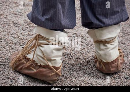 Man feet in national Russian leather shoes postol with rope Stock Photo ...