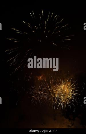 Fireworks exploding behind the smoke against black background Stock ...
