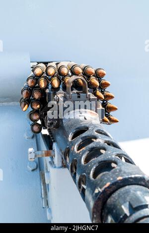 Cluster of 30 caliber ammunition, bullets, on top of double M1919 ...