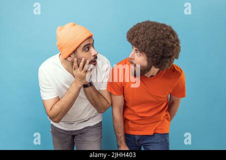 Two young men screaming each other Stock Photo - Alamy
