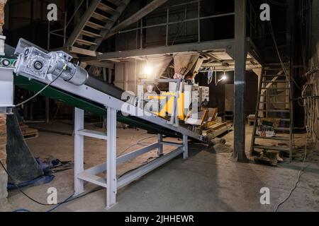 Cement packaging, bagging and stacking machine Stock Photo - Alamy