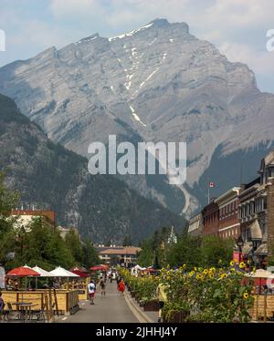 Scenic street view of the Banff Avenue in a sunny summer day. Banff is ...
