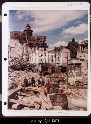 A Street Square, Filled With Rubble Is The Meeting Place For Four ...
