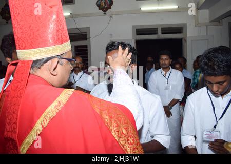 Catholic bishop is giving Confirmation sacrament Stock Photo - Alamy