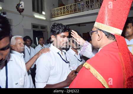 Catholic bishop is giving Confirmation sacrament Stock Photo - Alamy