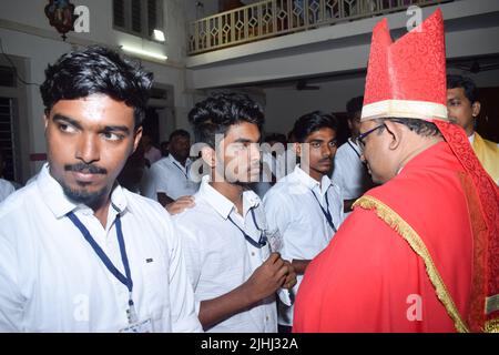 Catholic bishop is giving Confirmation sacrament Stock Photo - Alamy