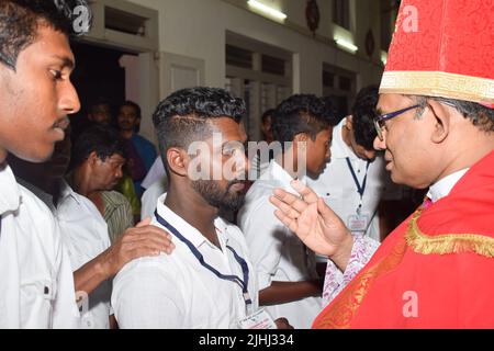 Catholic bishop is giving Confirmation sacrament Stock Photo - Alamy