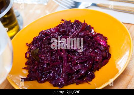 Braised red cabbage in orange plate Stock Photo - Alamy