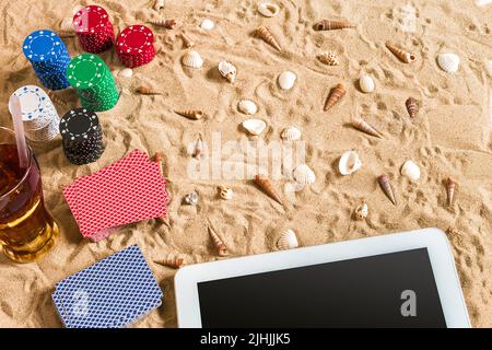 Gambling on vacation concept - white sand with seashells , colored ...