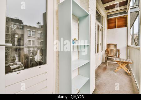 Front view of buildings and cars with bicycles from small balcony with ...