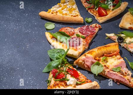 Various taste type pizza pieces with different traditional filling ...