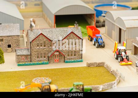 Handmade models of farm buildings and a farmyard with livestock Stock ...