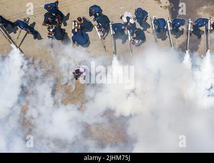 Police spraying smoke and pesticide on streets to fight dengue ...