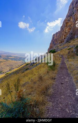 View of rocks, cliffs, footpath with Israel National Trail mark, and ...