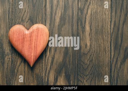 Wooden heart on the oak table Stock Photo - Alamy