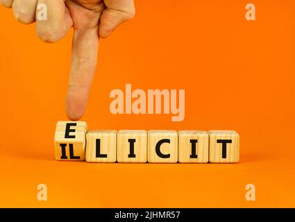 Illicit or elicit symbol. Businessman turns wooden cubes and changes ...
