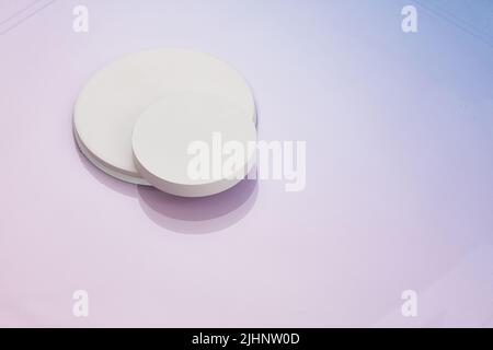 Thre circular white risers on gradient pnk to blue background. Mock up ...