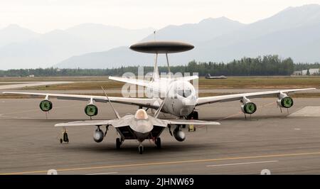 U.S. Air Force Col. Travolis A. Simmons, center, passes the 3rd Wing ...