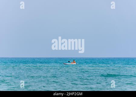 Young man kayaking in the Mediterranean sea. Kayaking sport concept ...