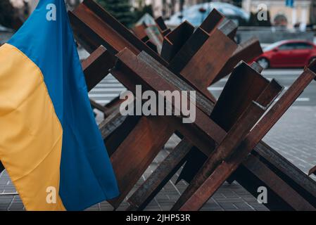 The Ukrainian flag hangs on barricades in the city Stock Photo - Alamy