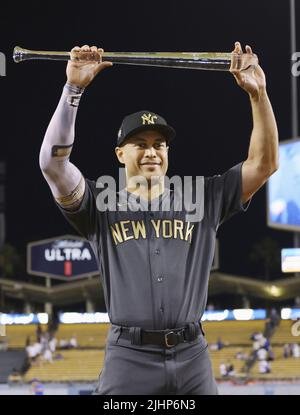New York Yankees Giancarlo Stanton smiles while he stands on third base ...