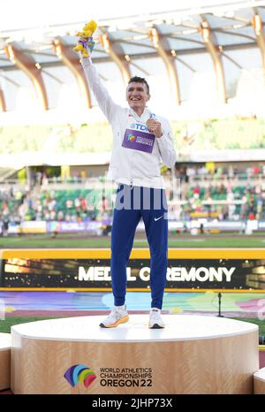 Gold medalist Jake Wightman, of Britain, poses on the podium after the ...