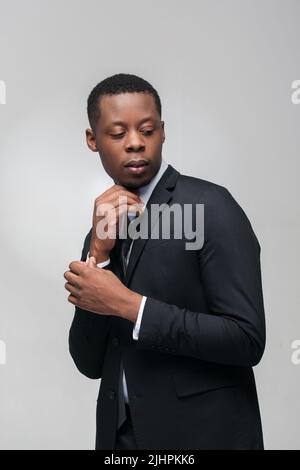 Afroamerican guy in expensive fancy black suit Stock Photo - Alamy