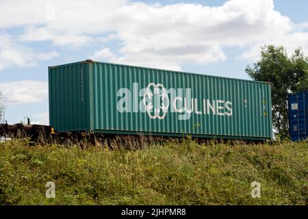 A Culines shipping container on a freightliner train, Warwickshire, UK ...