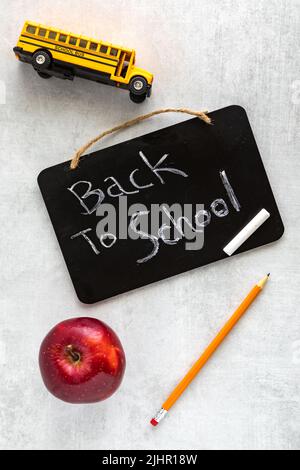 Items to depict a back to school concept, against a white background ...