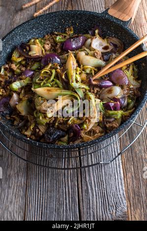 Minced meat with fresh spring onions and spices in the shape of a pig ...