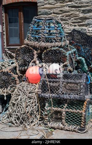 old fishermans lobster pots crab boxes barrels and deflated dingies in ...