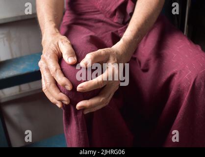Knee joint pain in Asian Myanmar elder man. Concept of osteoarthritis ...