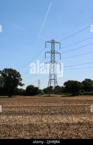 Full frame image of electricity pylon and wires against blue sky Stock ...