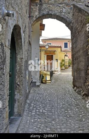 A stone narrow street of Fontana Liri, Rome, Italy with old houses ...