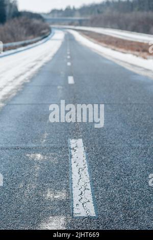 Winter empty highway with a dashed white line Stock Photo - Alamy