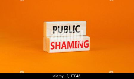 Public shaming symbol. Concept words Public shaming on wooden blocks on ...