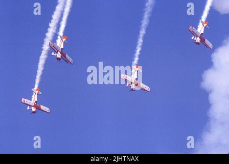 Biplane diving towards the ground with smoke coming from it. See ...