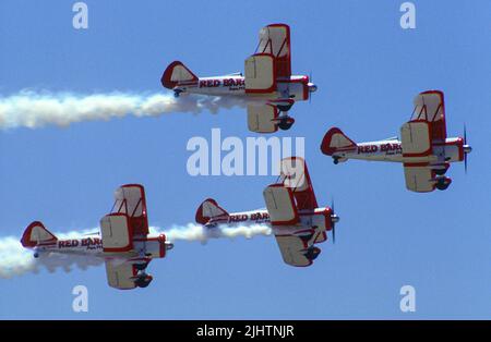 Red Baron Stearman Squadron in formation starting individual loops ...