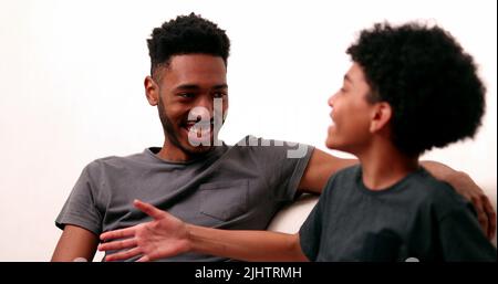 Two brothers talk interaction, black african siblings in conversation ...
