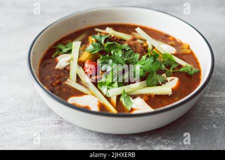 plant-based Mexican vegetable stew with beans mock meat celeri and ...