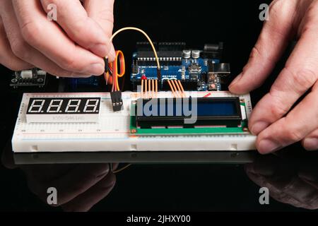 Arduino Uno microcontroller board with components and specifications ...