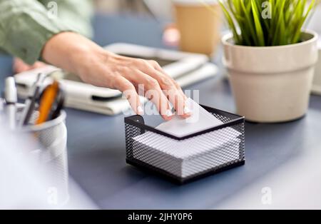 businesswoman taking note paper at office Stock Photo - Alamy